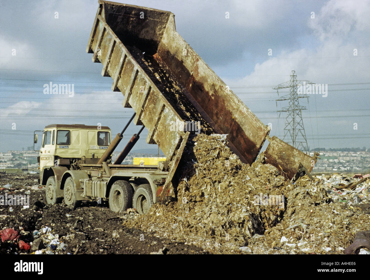 Rubbish lorry emptying waste onto a landfill tip site Wales UK Stock ...