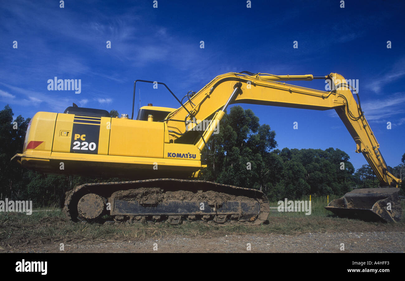 Komatsu Excavator PC 220 showing body, bucket and tracks. Blue sky ...