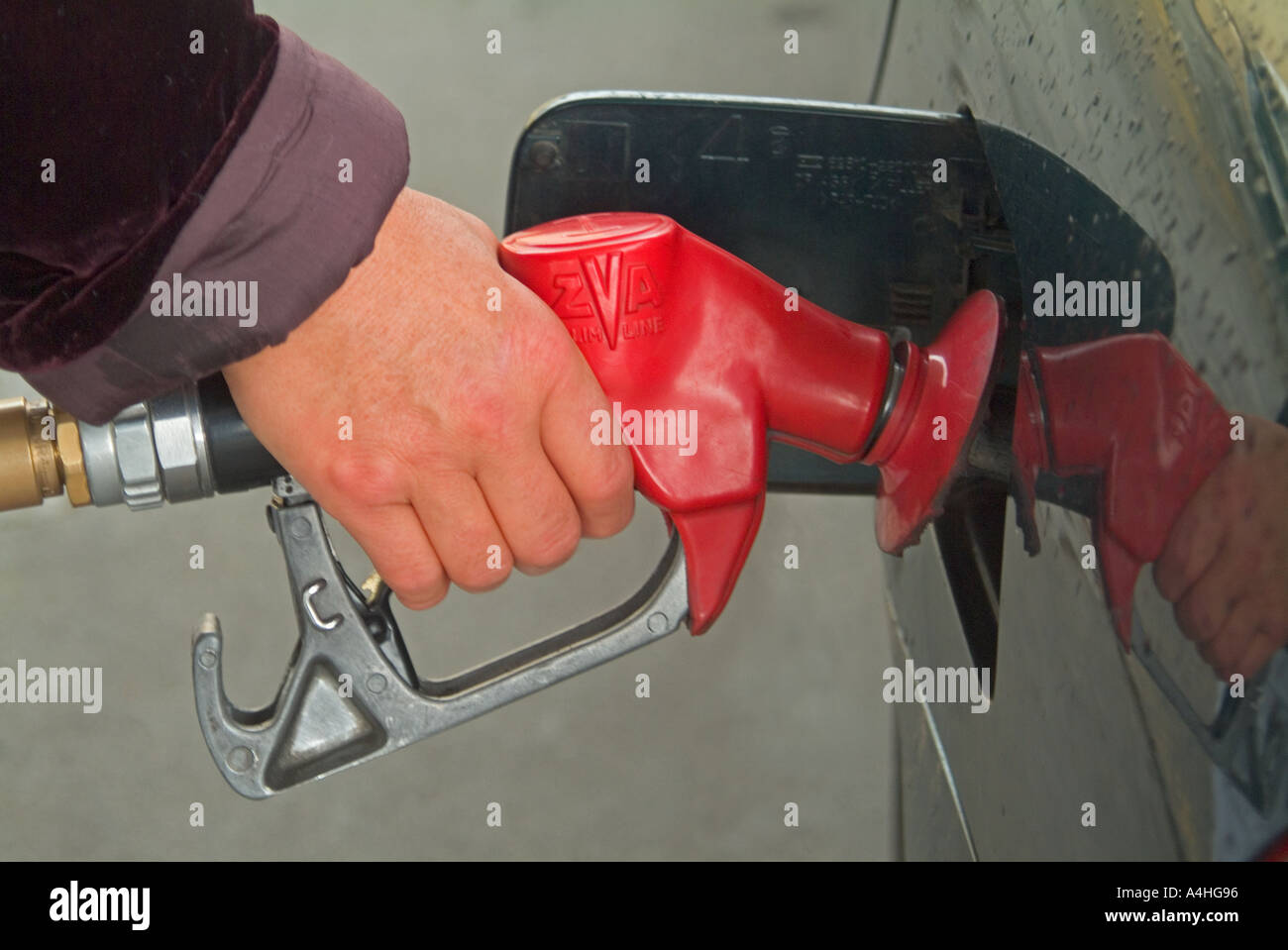 Refuelling a compact car with unleaded petrol Stock Photo - Alamy