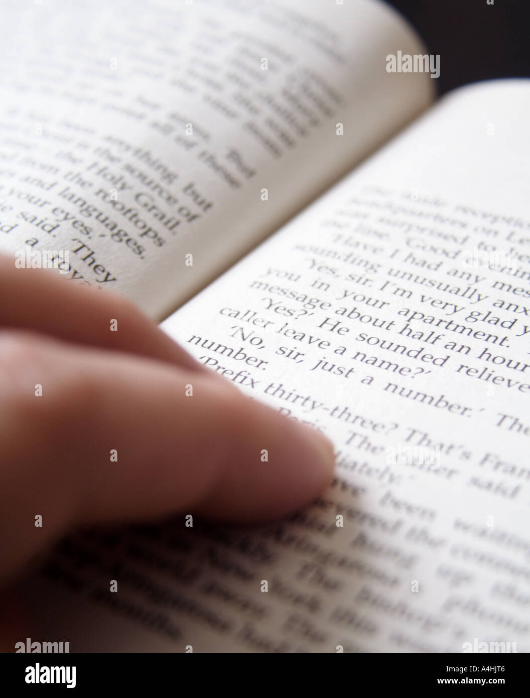 reading a open book Stock Photo - Alamy