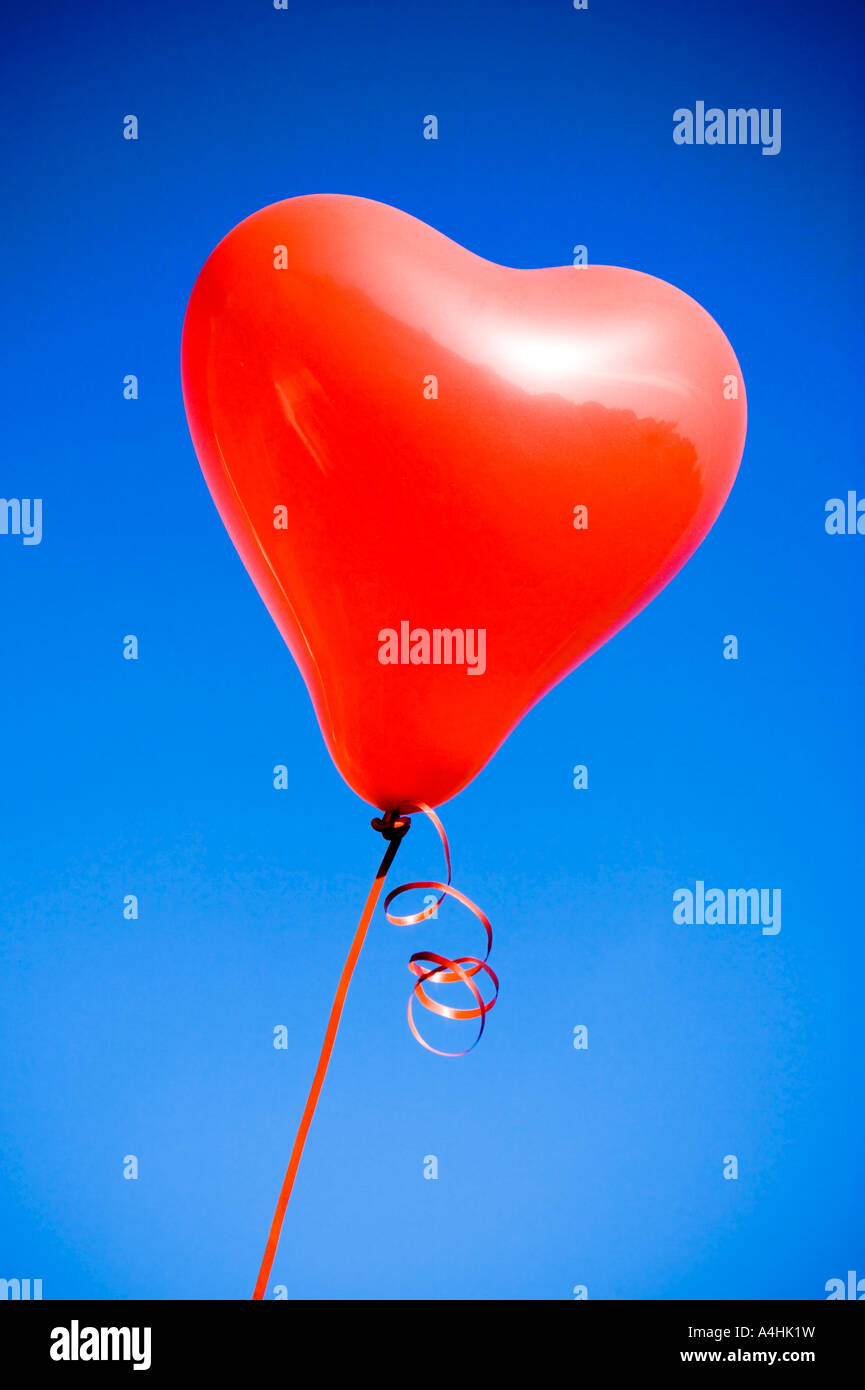 Red heart shaped balloon Stock Photo - Alamy