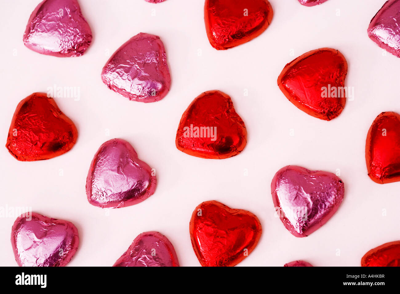 Pink and red foil covered chocolate Stock Photo - Alamy