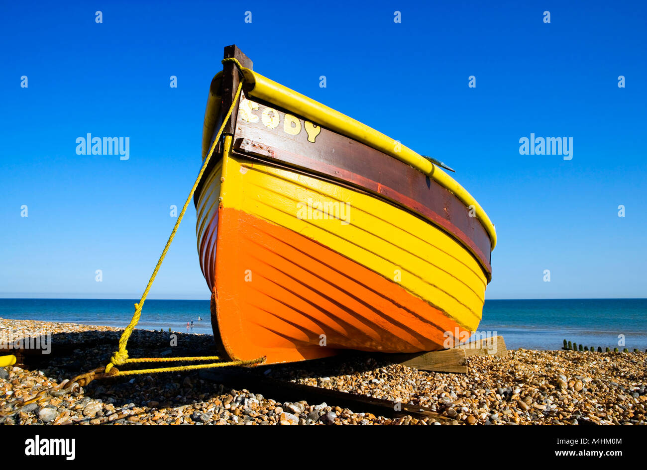 Yellow fishing boat Stock Photo - Alamy