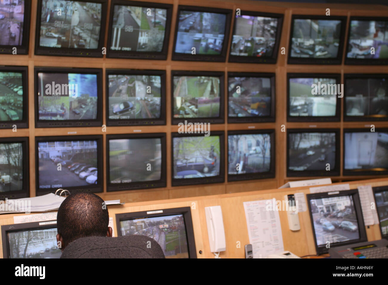 Man in front of many screens hi-res stock photography and images - Alamy