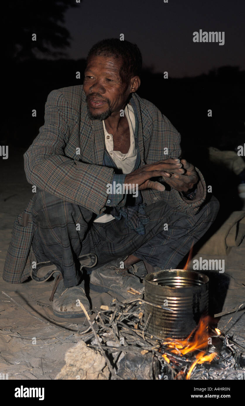 Bushman San sitting at a fire Kalahari Northern Cape South Africa Stock ...