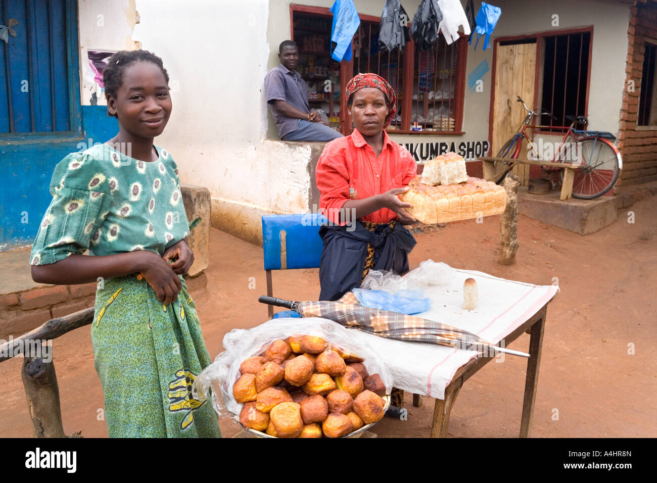Ladies selling doughnuts and bread buns at Nsalu (Nsaru) market Malawi ...