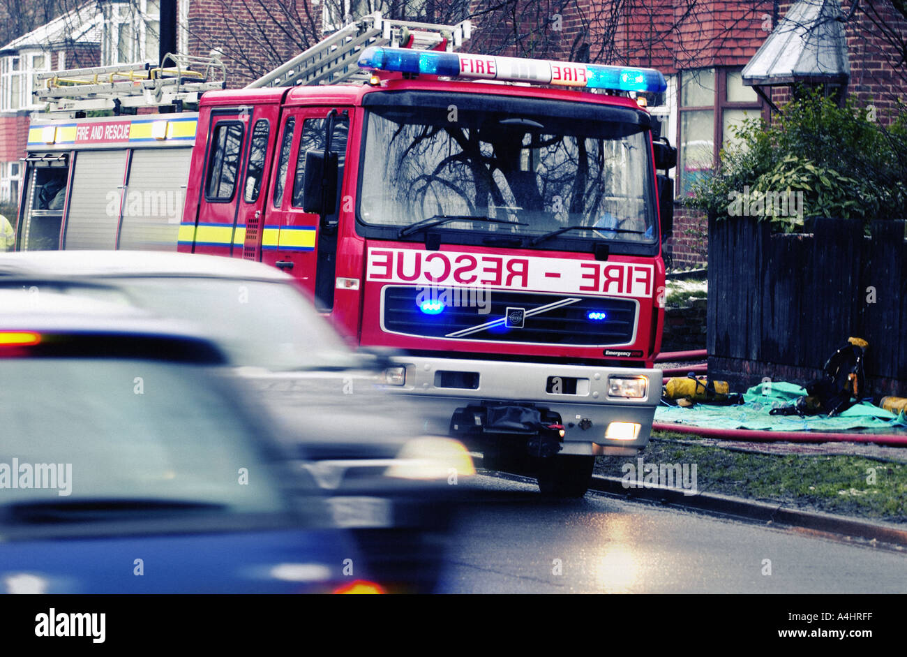 Fire Engine attending incident in busy suburban UK street Stock Photo ...