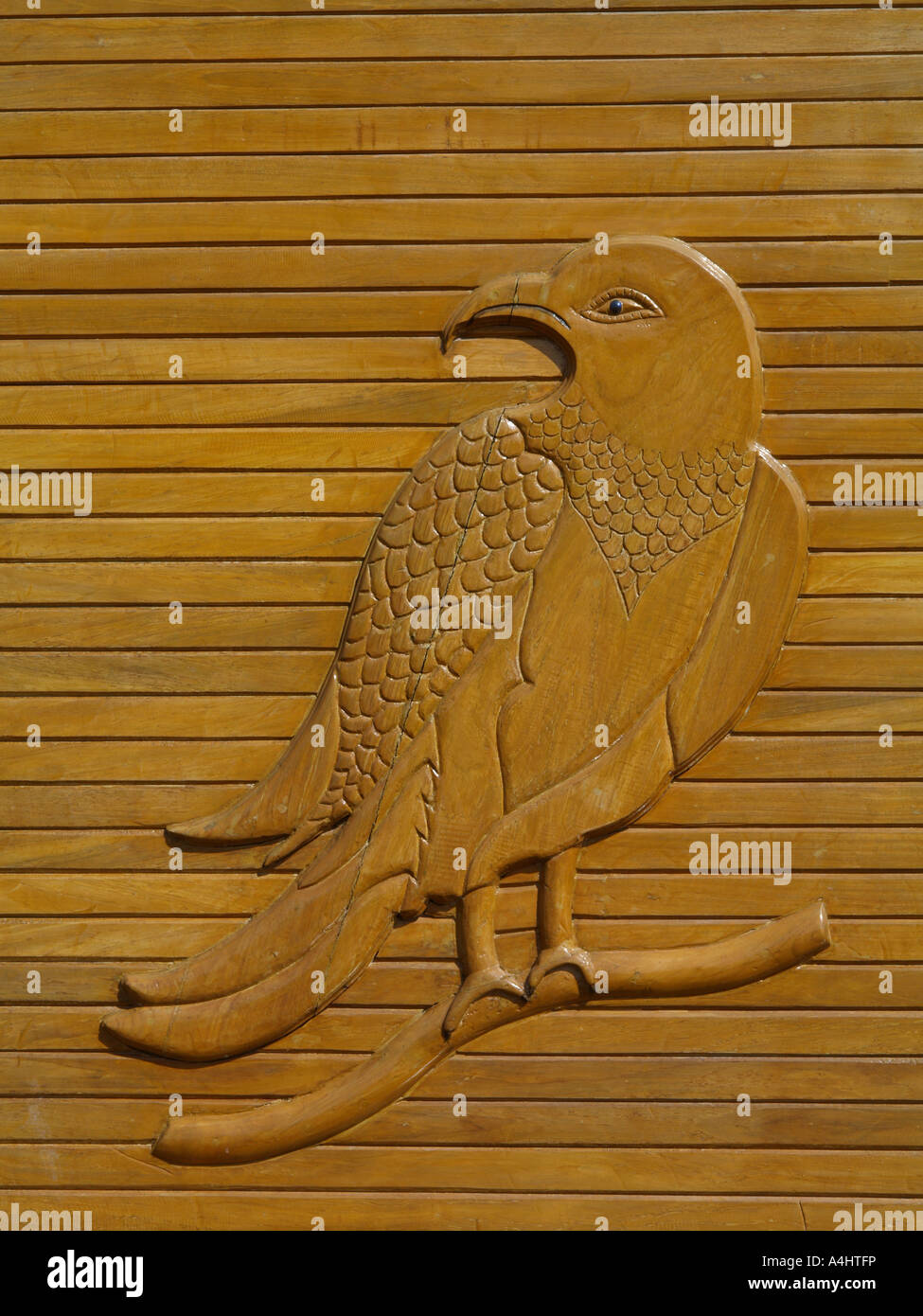 wood carving of a falcon Stock Photo - Alamy