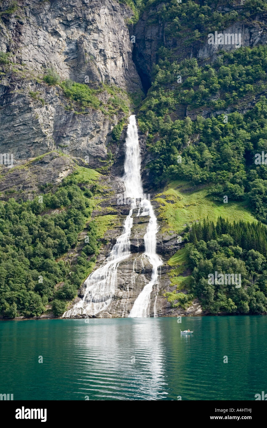 A waterfall flowing into the Geiranger Fjord Geirangerfjorden Norway ...