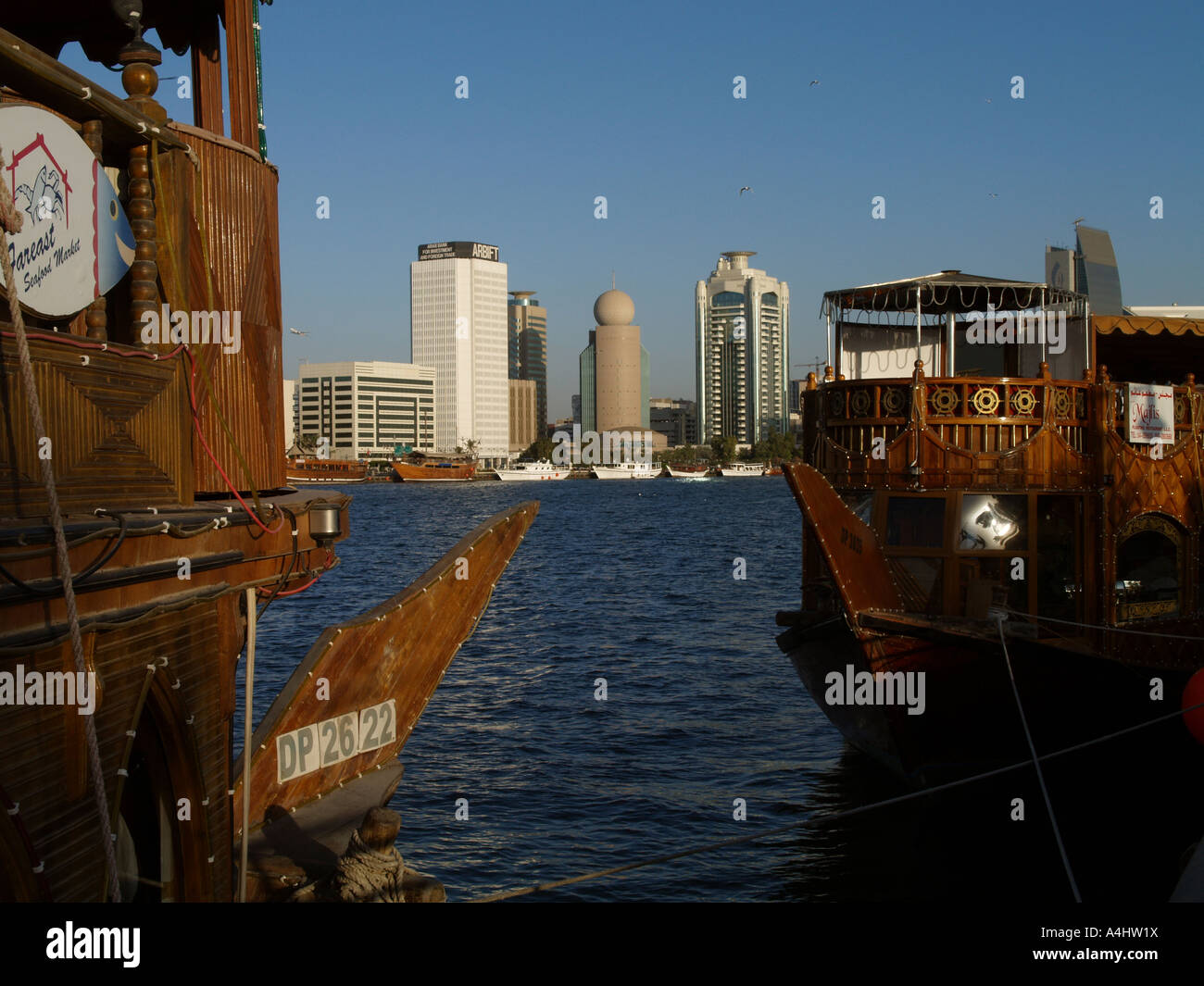 Dubai Creek, traditional wooden ship, dhow Stock Photo - Alamy