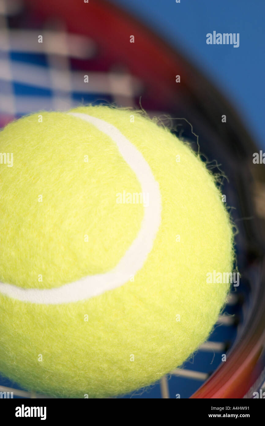 Tennis ball on racket close up Stock Photo - Alamy