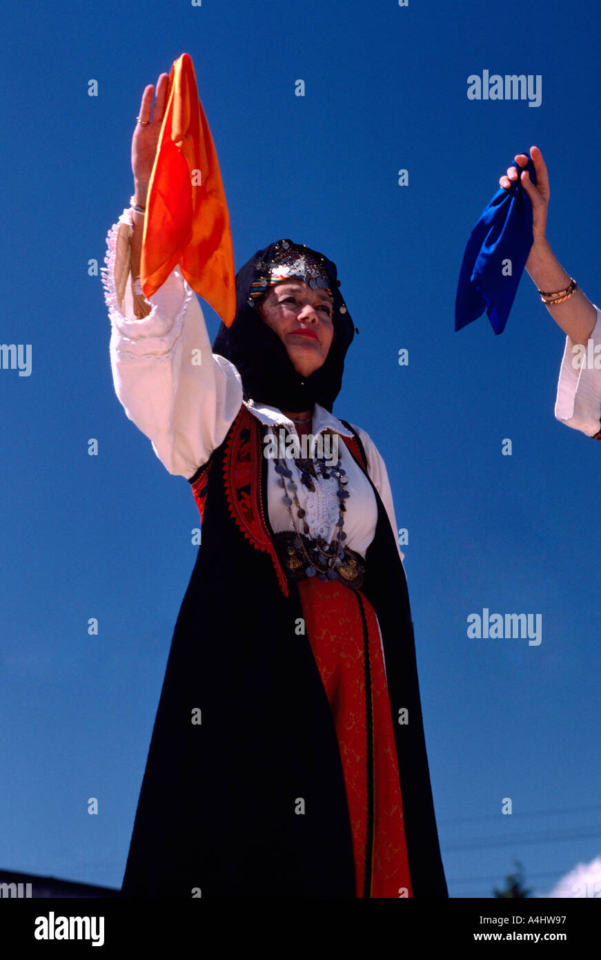 A Greek Woman in Ethnic Dress performs a Traditional Greek Dance in the ...
