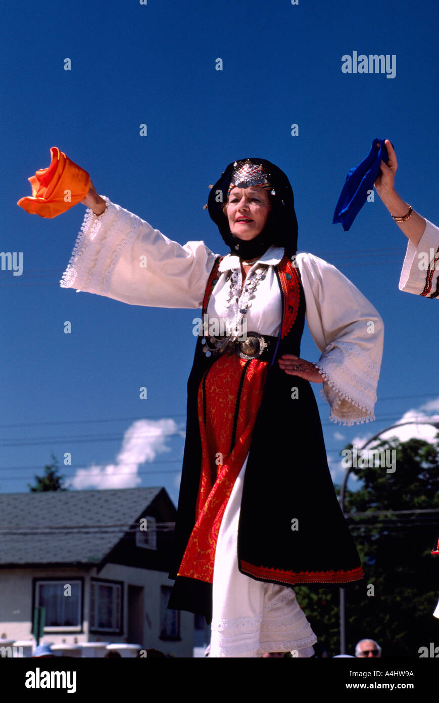 A Greek Woman in Ethnic Dress performs a Traditional Greek Dance in the ...