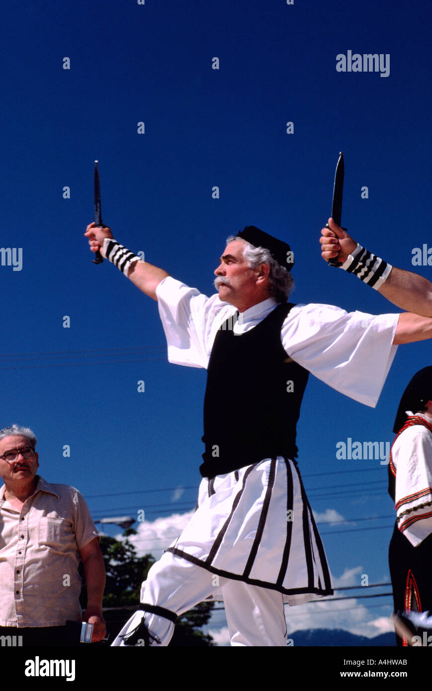 Greek Men in Ethnic Dress perform a Traditional Greek Dance in the City ...