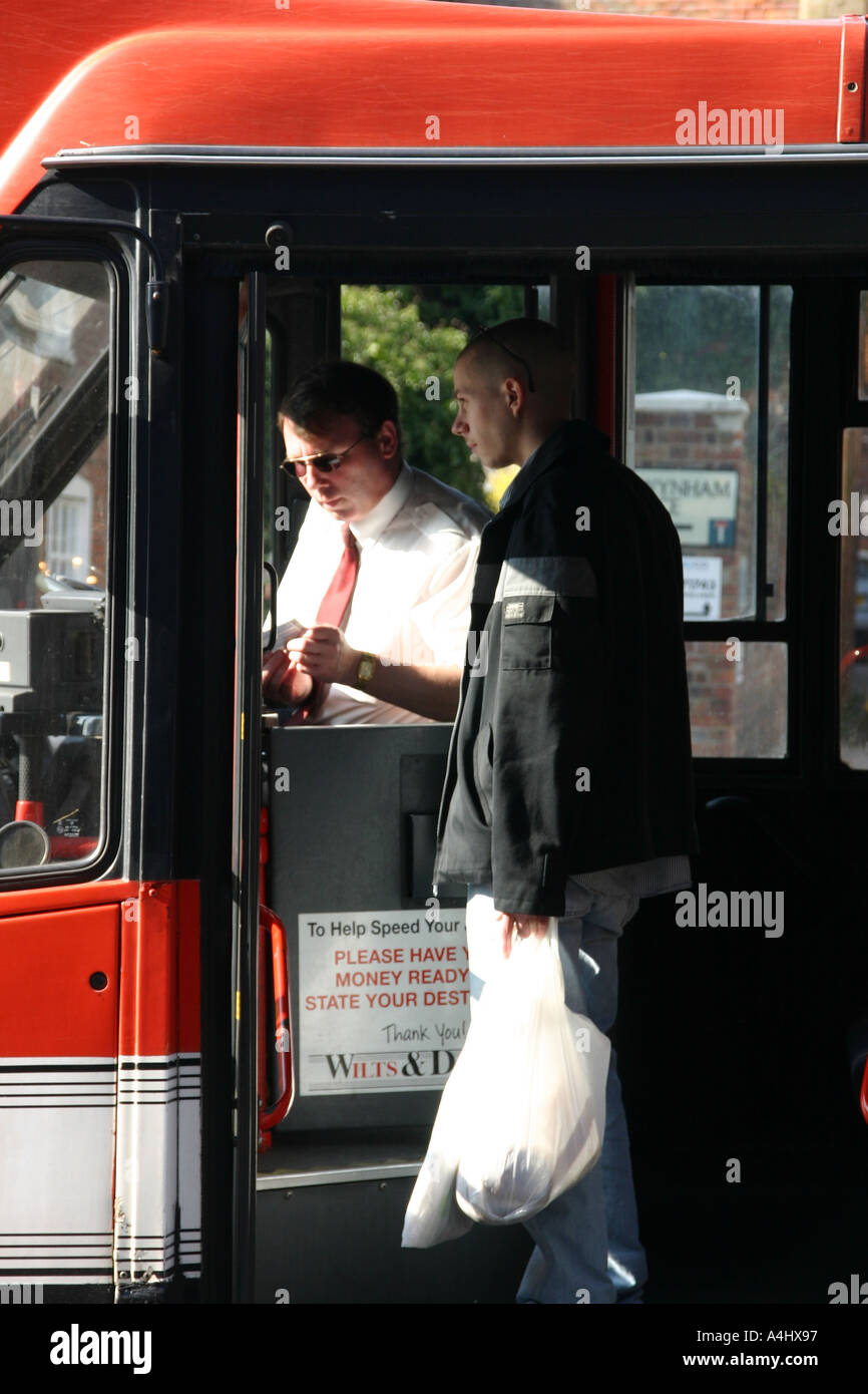 Men getting on a bus Stock Photo - Alamy