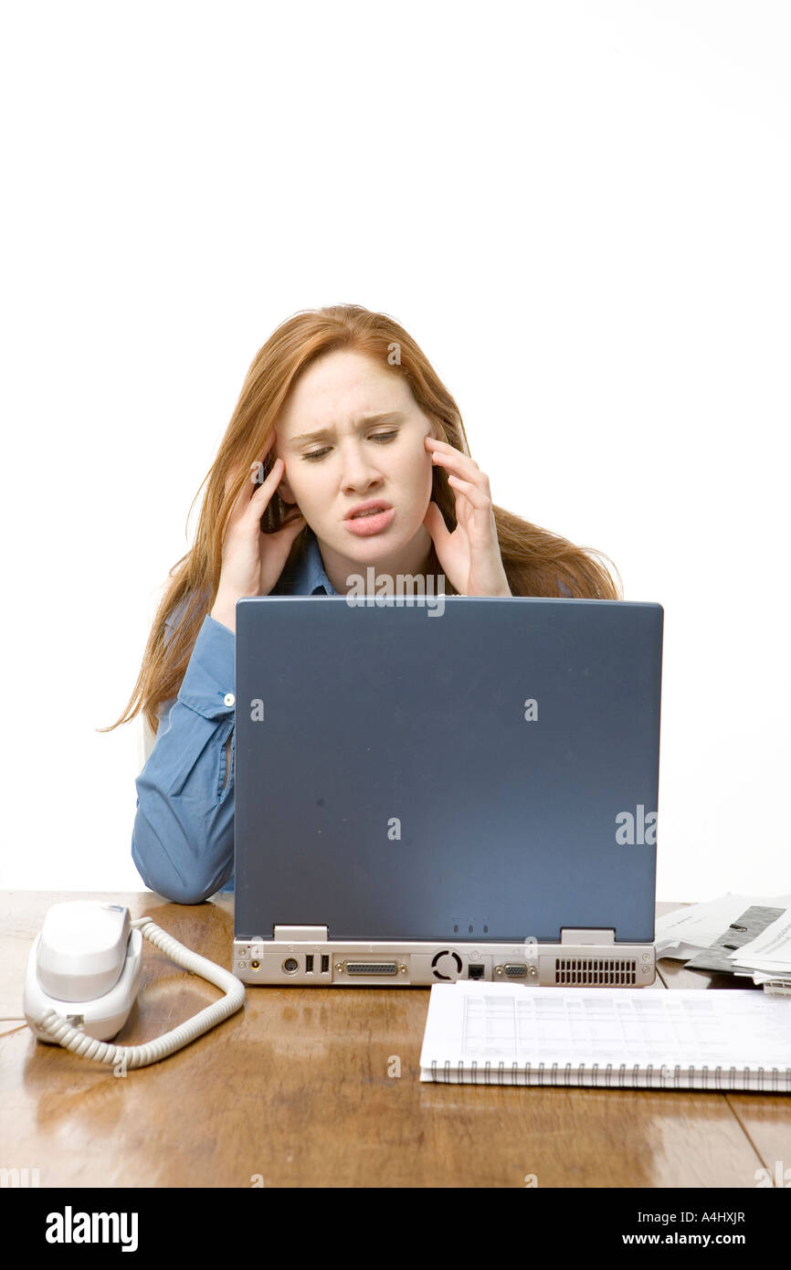 Woman looking at a computer in frustration Stock Photo - Alamy