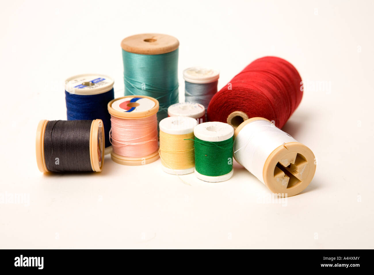 Reels of different coloured thread Stock Photo - Alamy