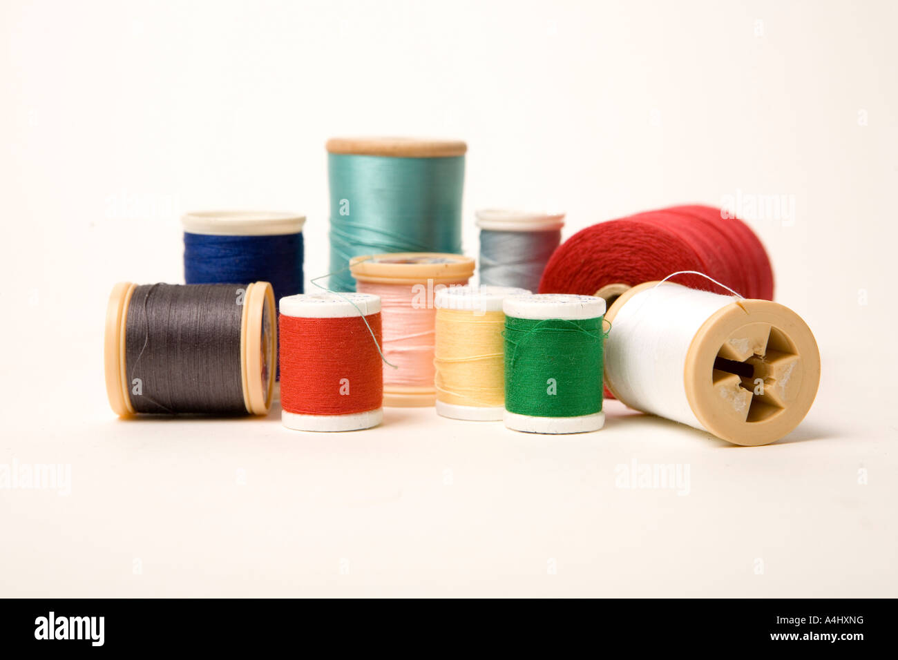 Reels of different coloured thread Stock Photo - Alamy