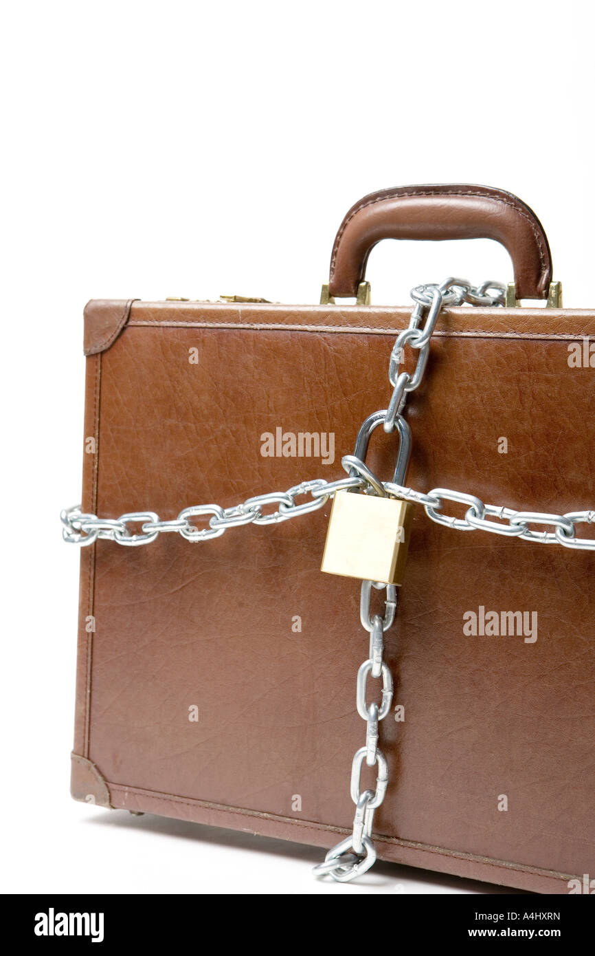 Brief case locked in chains Stock Photo - Alamy