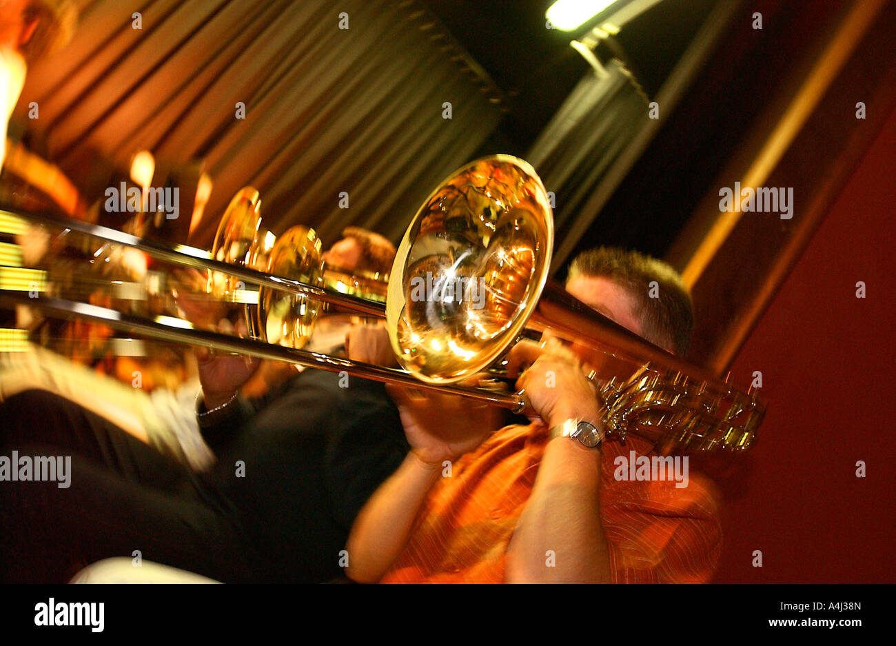 Set of musicians playing the slide trombone Stock Photo - Alamy