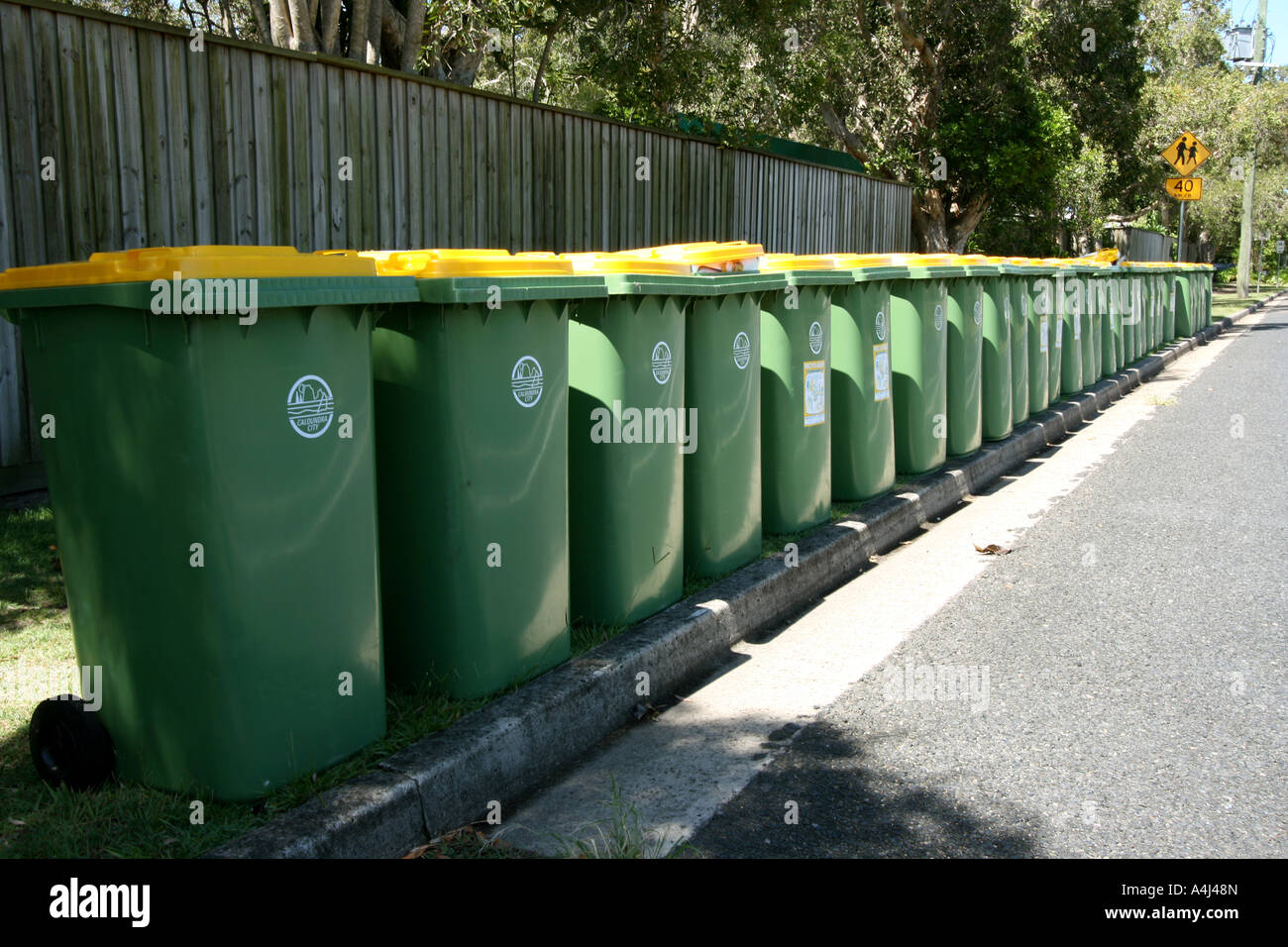 ROW OF GARBAGE BINS ON THE SIDE OF THE ROAD HORIZONTAL BAPDB10156 Stock ...