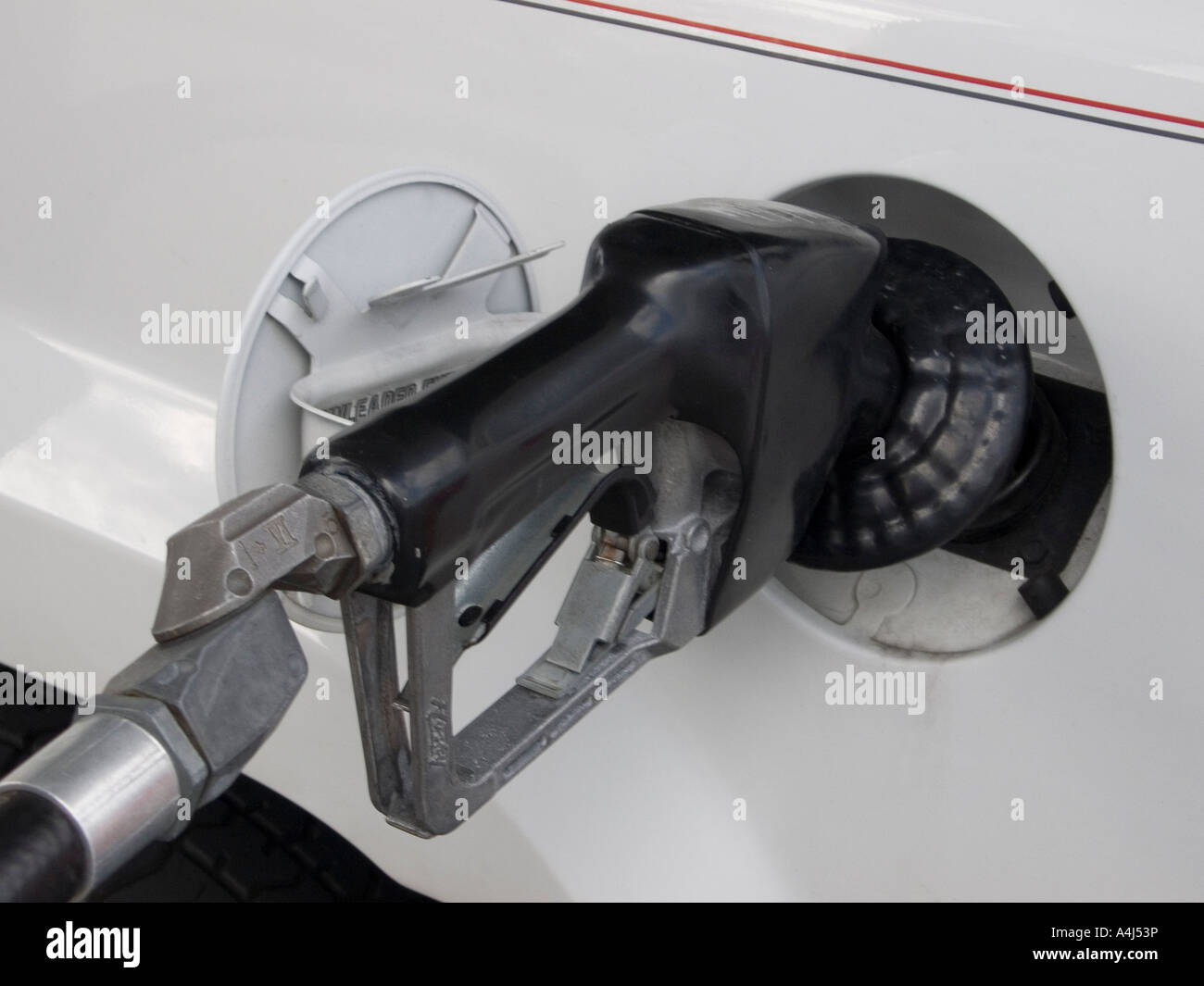 gas nozzle in an automobile gas tank Stock Photo - Alamy