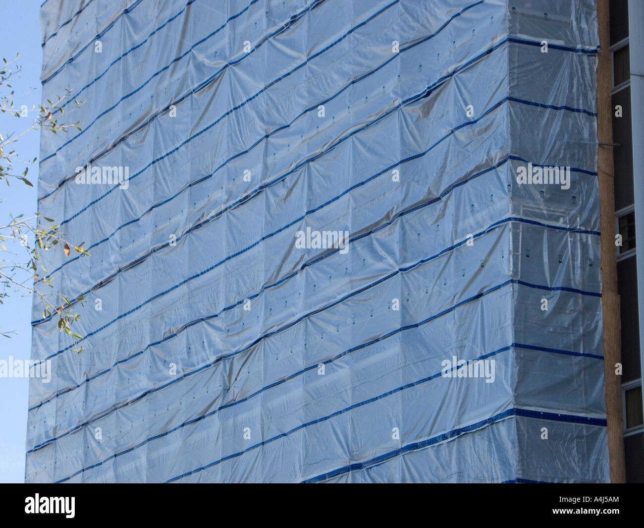 heavy plastic material protective covering over construction on a ...