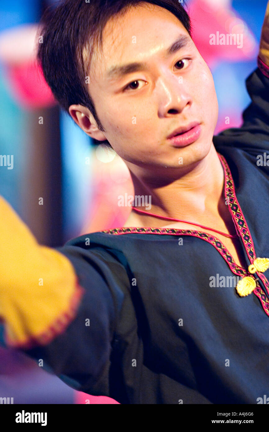 CHINA YANGTZE RIVER Handsome young Chinese dancer performs traditional ...