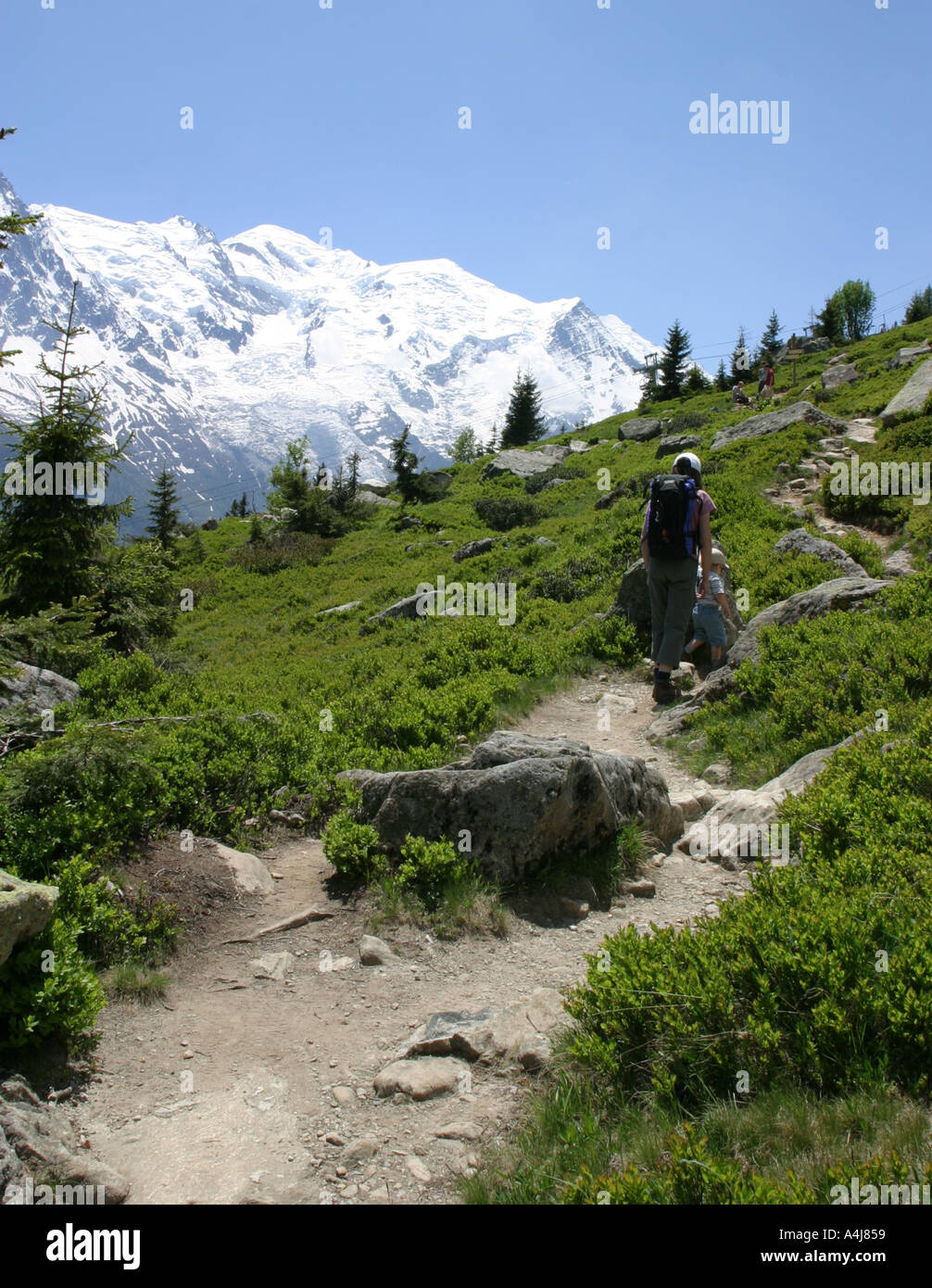Mother and child walking along mountain path in Chamonix Stock Photo ...