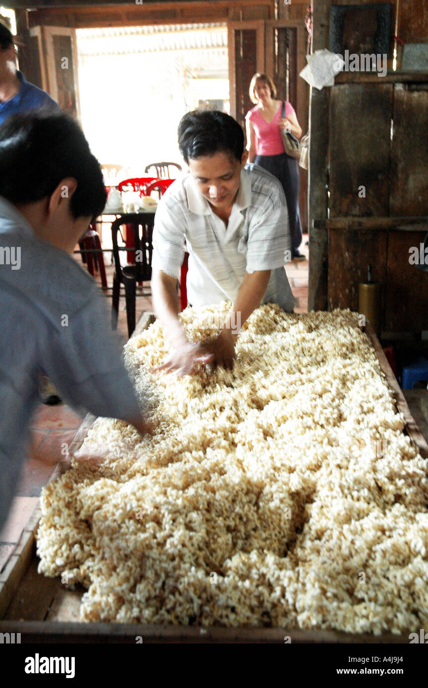 Laying out puffed rice Mekong Delta Vietnam Stock Photo - Alamy