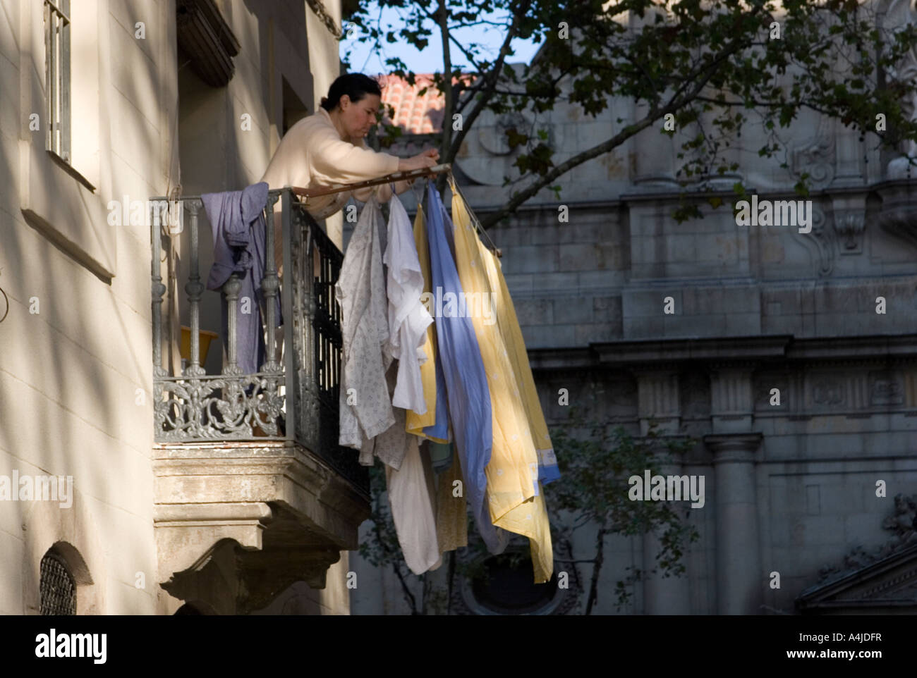 spanish lady with washing port olimpic Stock Photo - Alamy