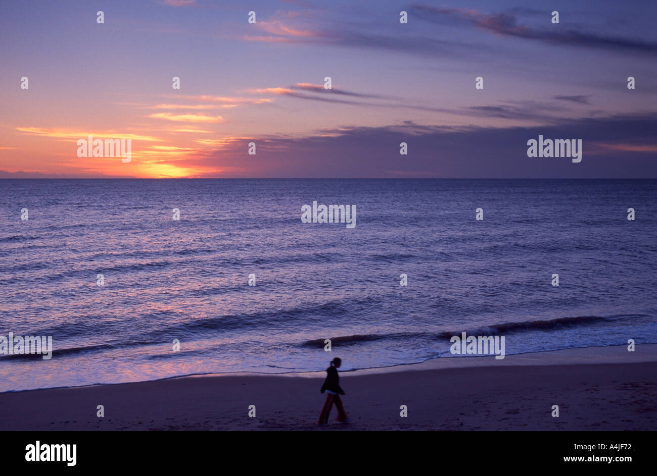 Woman alone on beach night hi-res stock photography and images - Alamy
