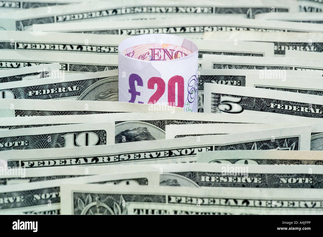 twenty pound note rising up from US 1 5 10 20 50 dollar bills Stock ...