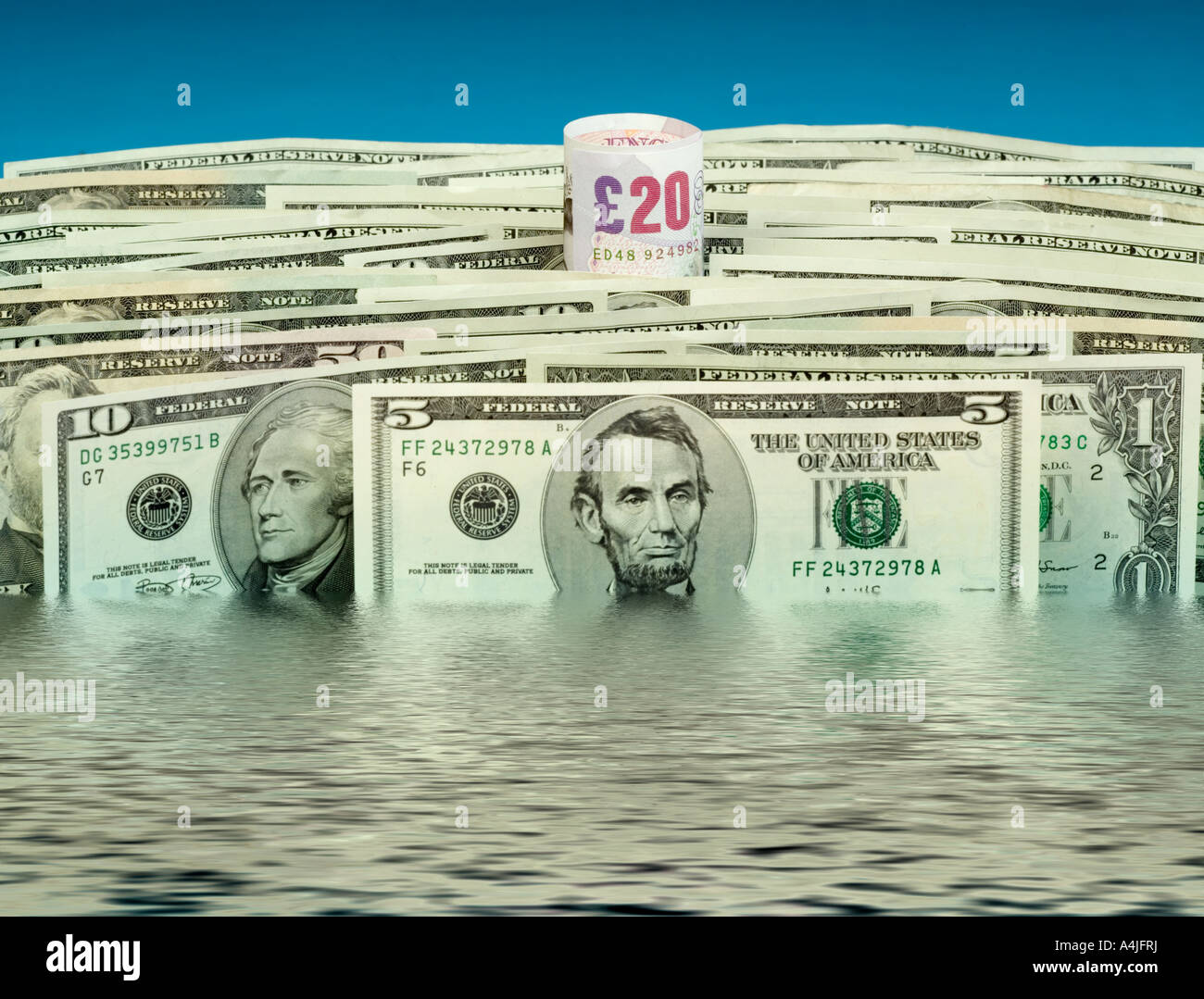 twenty pound note rising up from US 1 5 10 20 50 dollar bills Stock ...