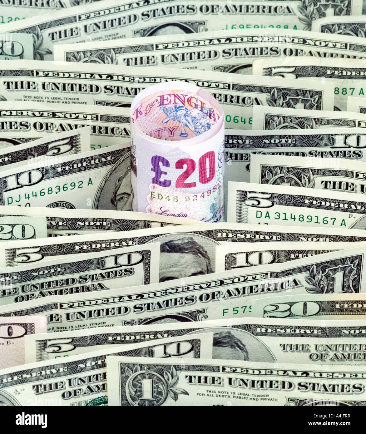 twenty pound note rising up from US 1 5 10 20 50 dollar bills Stock ...