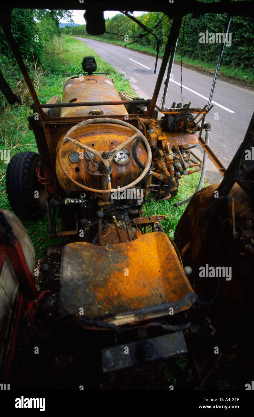 Burnt out tractor on the road side in Dorset county England UK Stock ...