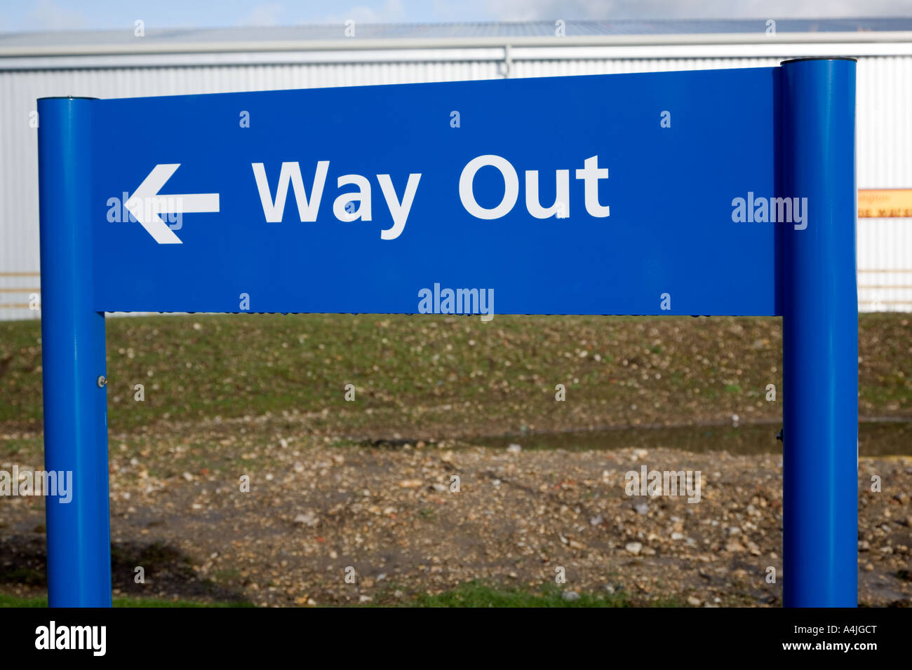 Way out sign and arrow on blue sign Stock Photo - Alamy