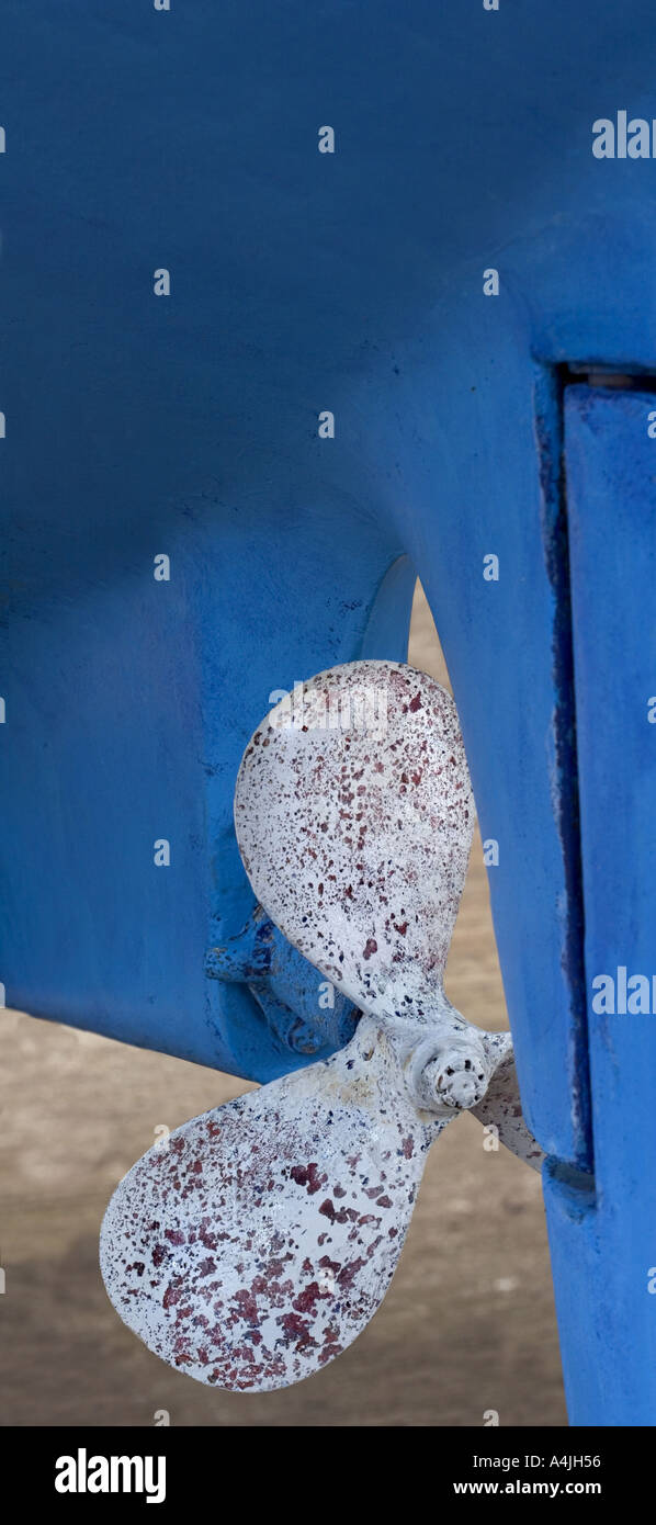 The rusting propeller of a blue hulled ship in dry dock Stock Photo - Alamy