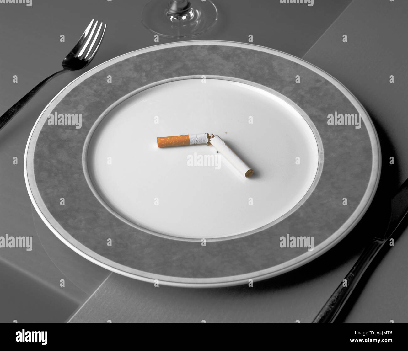 No Smoking at the table, broken cigarette on a dinner plate Stock Photo ...