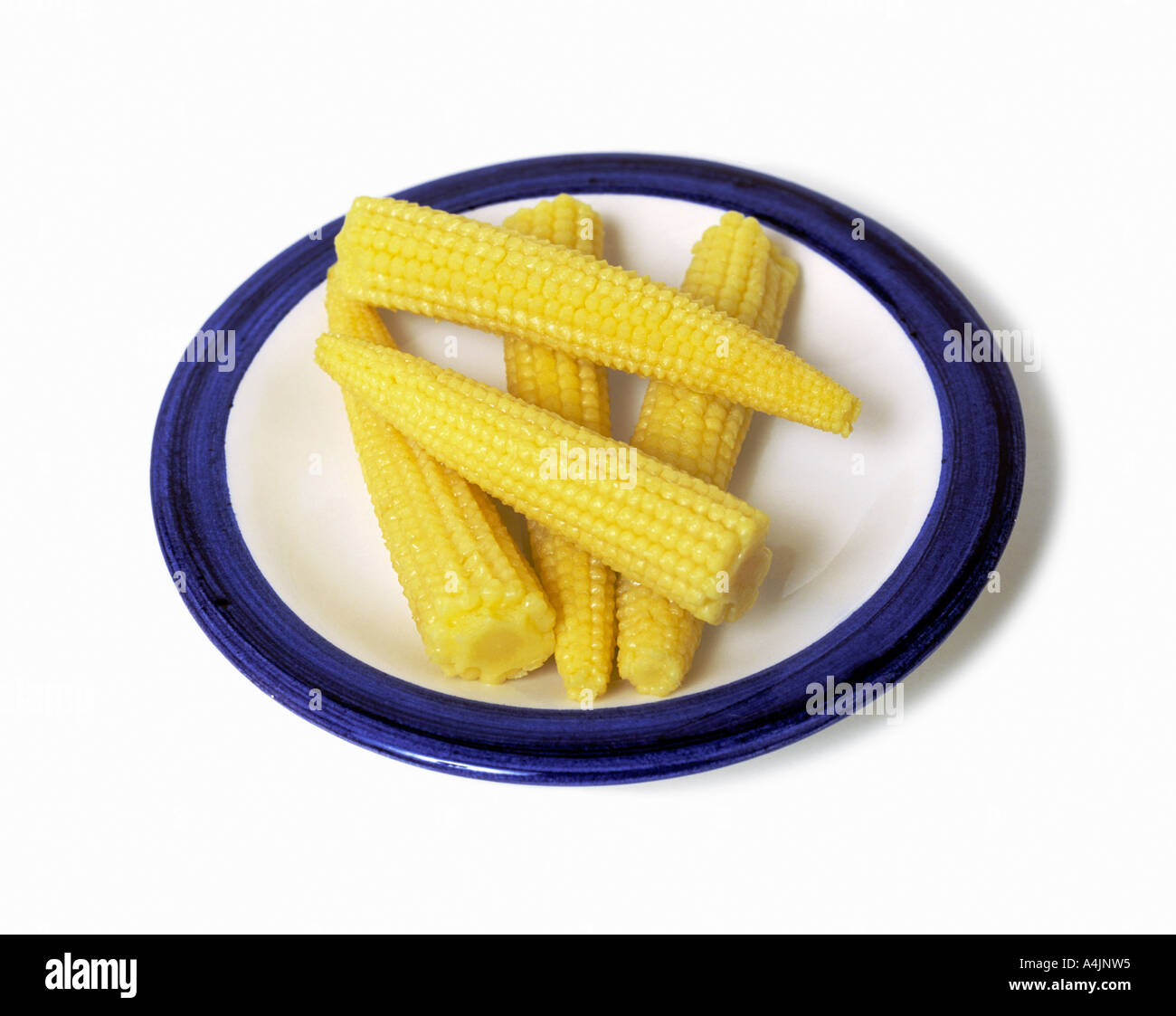 Mini sweetcorn on a small plate Stock Photo - Alamy