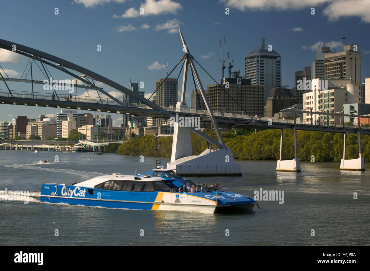 A CityCat catamaran on the Brisbane River with the Goodwill Bridge ...