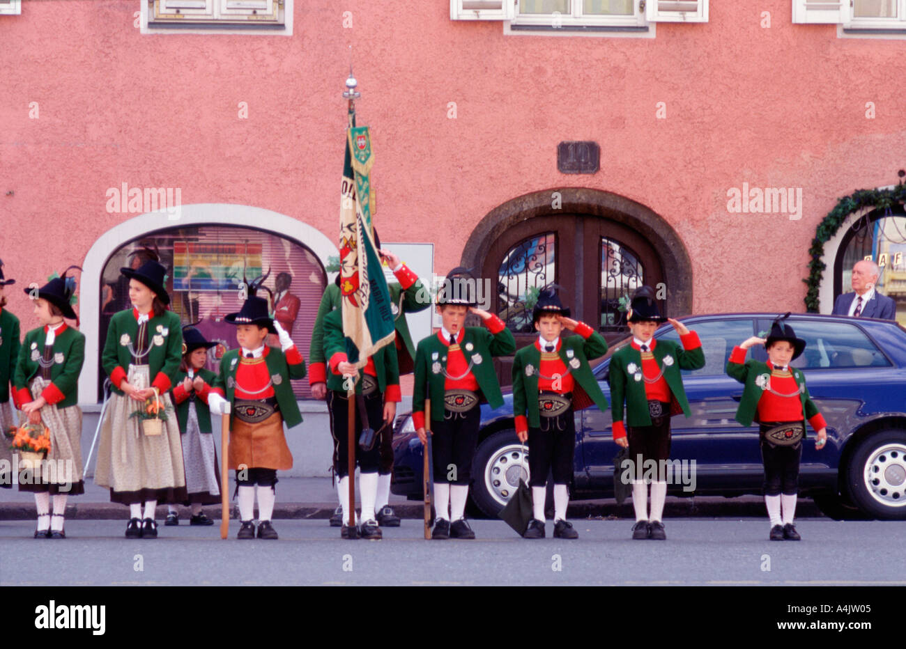 Children in traditional dress salute at Tyrolean folk parade at austria ...