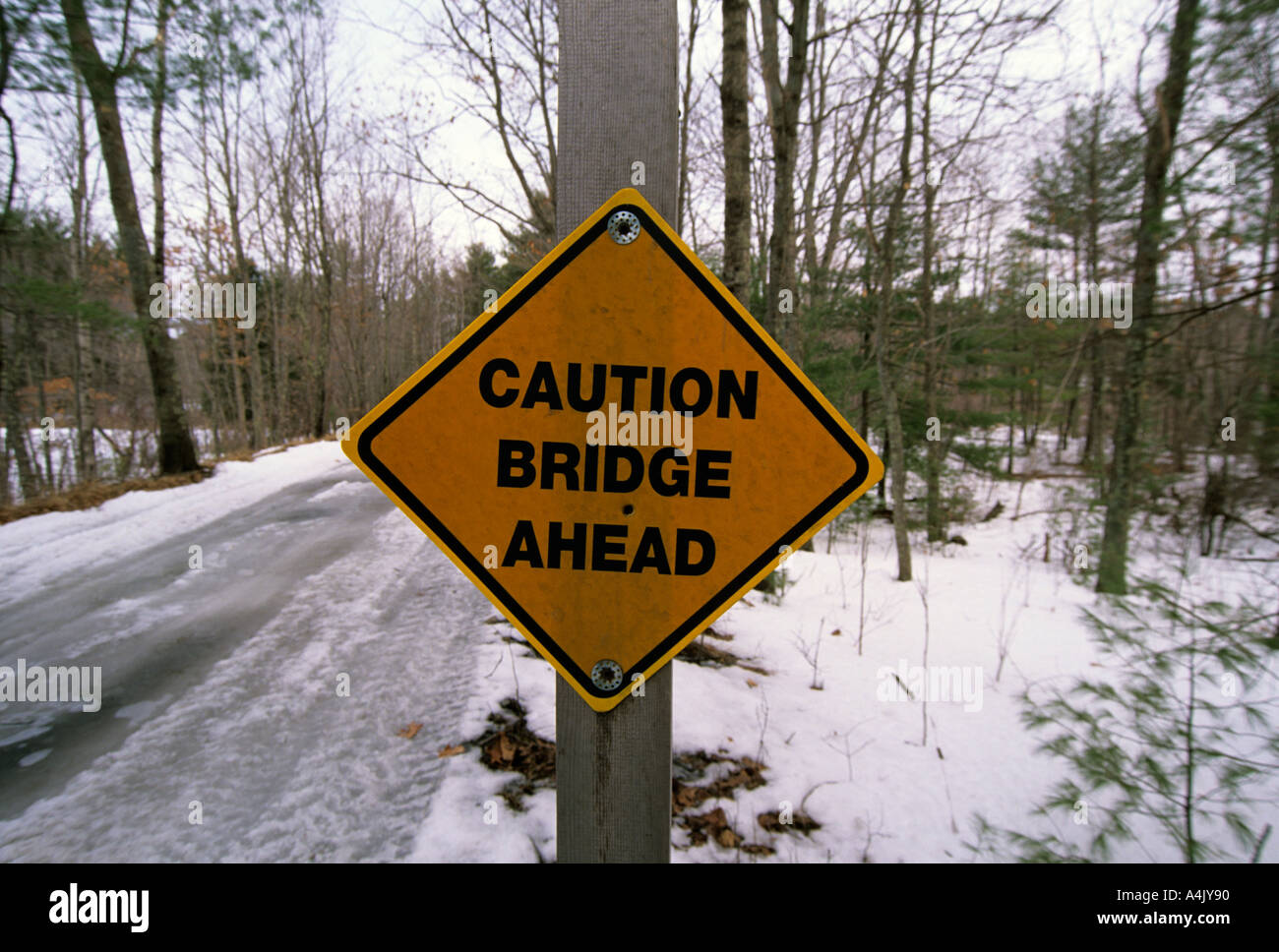 Yellow Caution bridge ahead sign with black lettering Stock Photo - Alamy