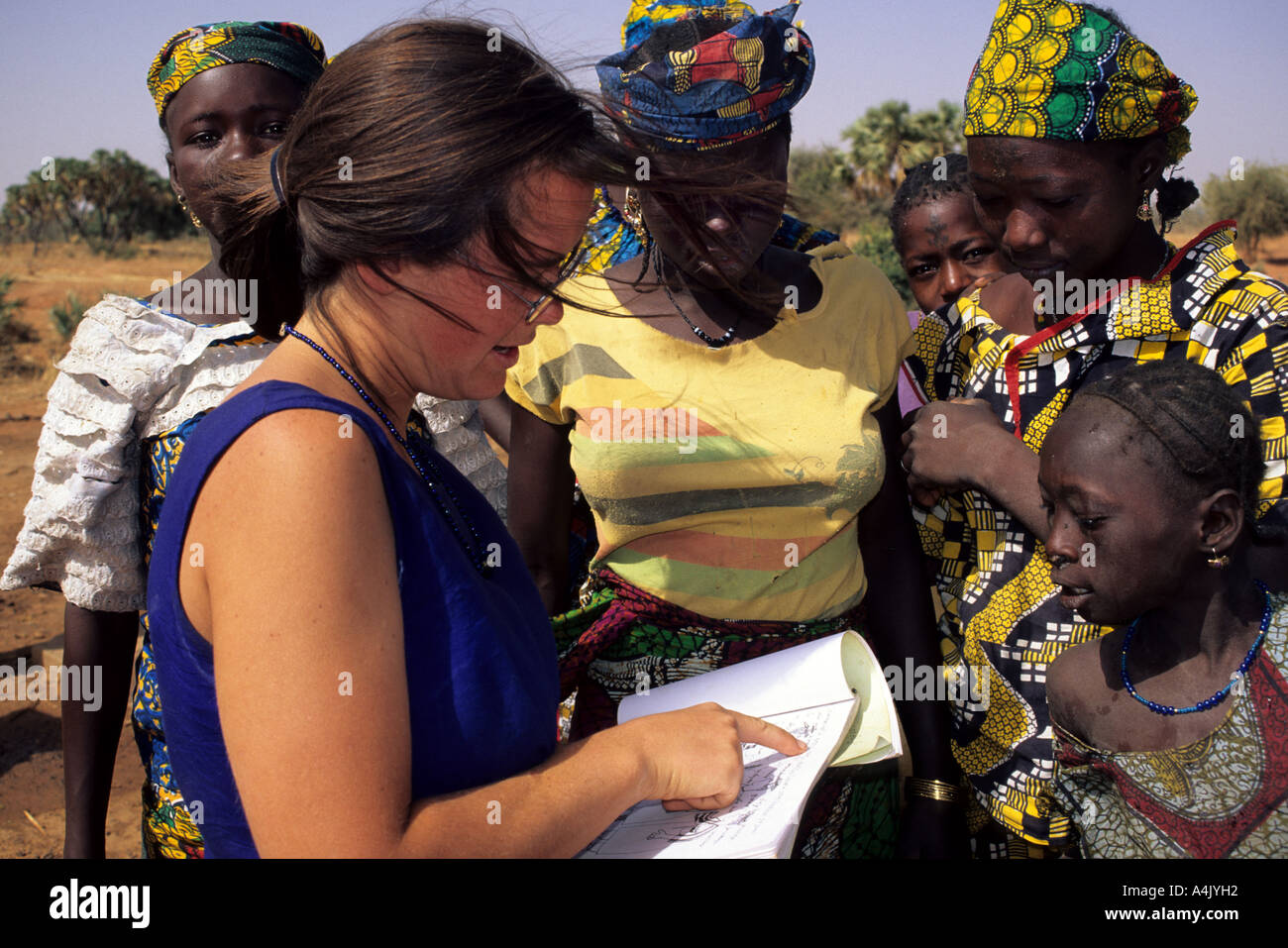 Djiliki, Niger. Peace Corps Volunteer Checking Literacy Workbook of ...