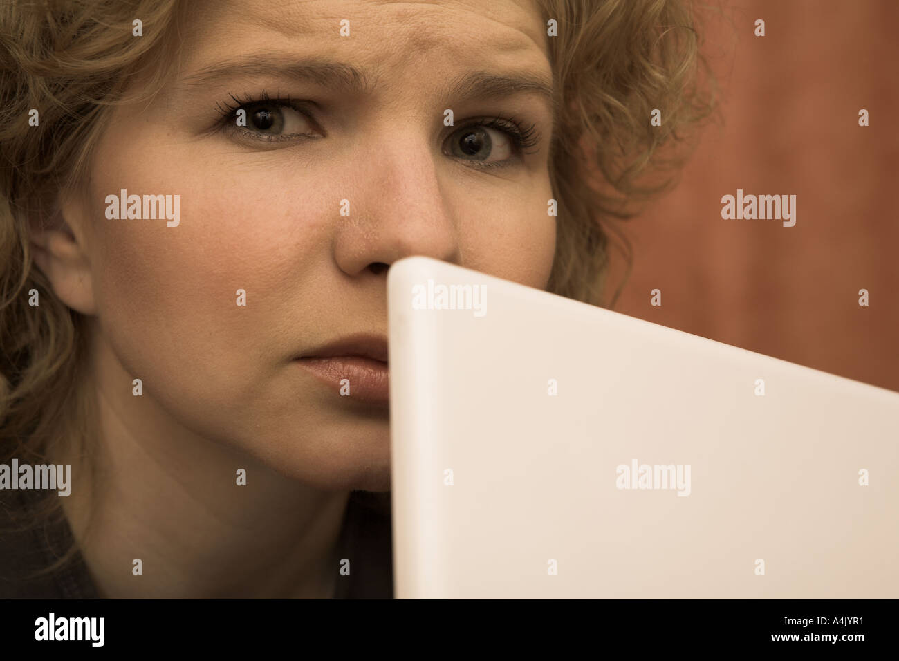 Woman on laptop stressed hiding face hi-res stock photography and ...