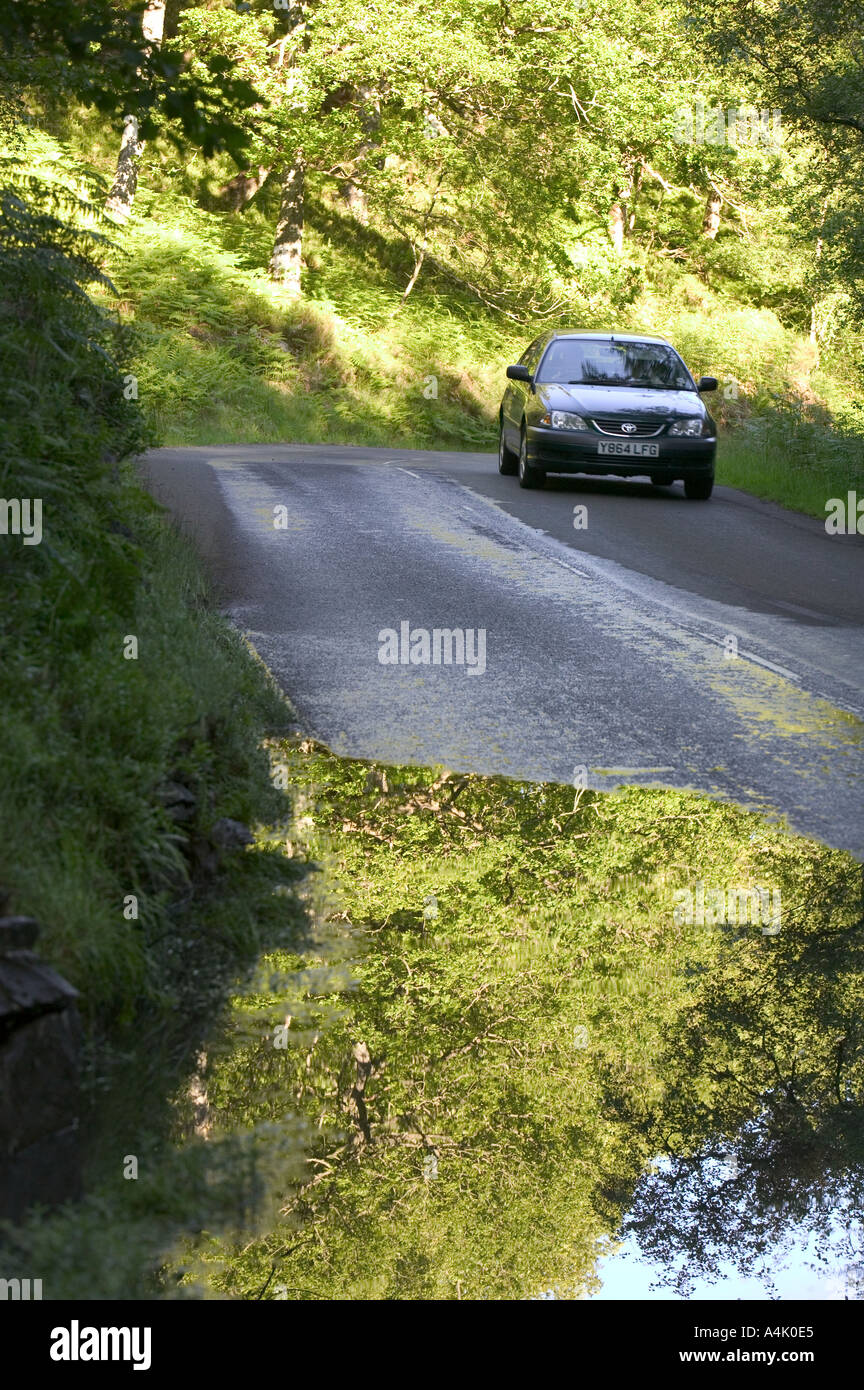 Car driving puddle hi-res stock photography and images - Alamy