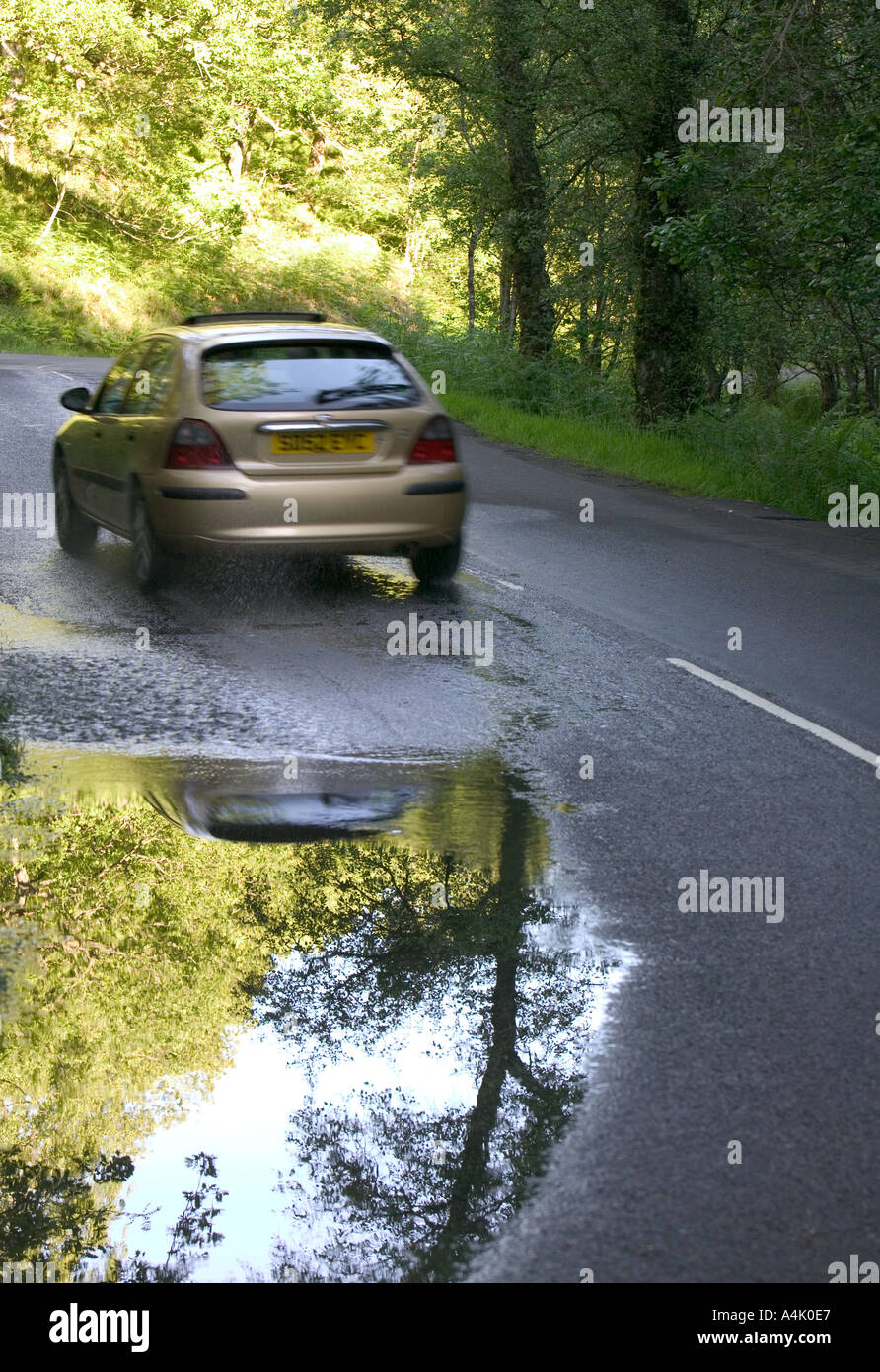 Car driving puddle hi-res stock photography and images - Alamy