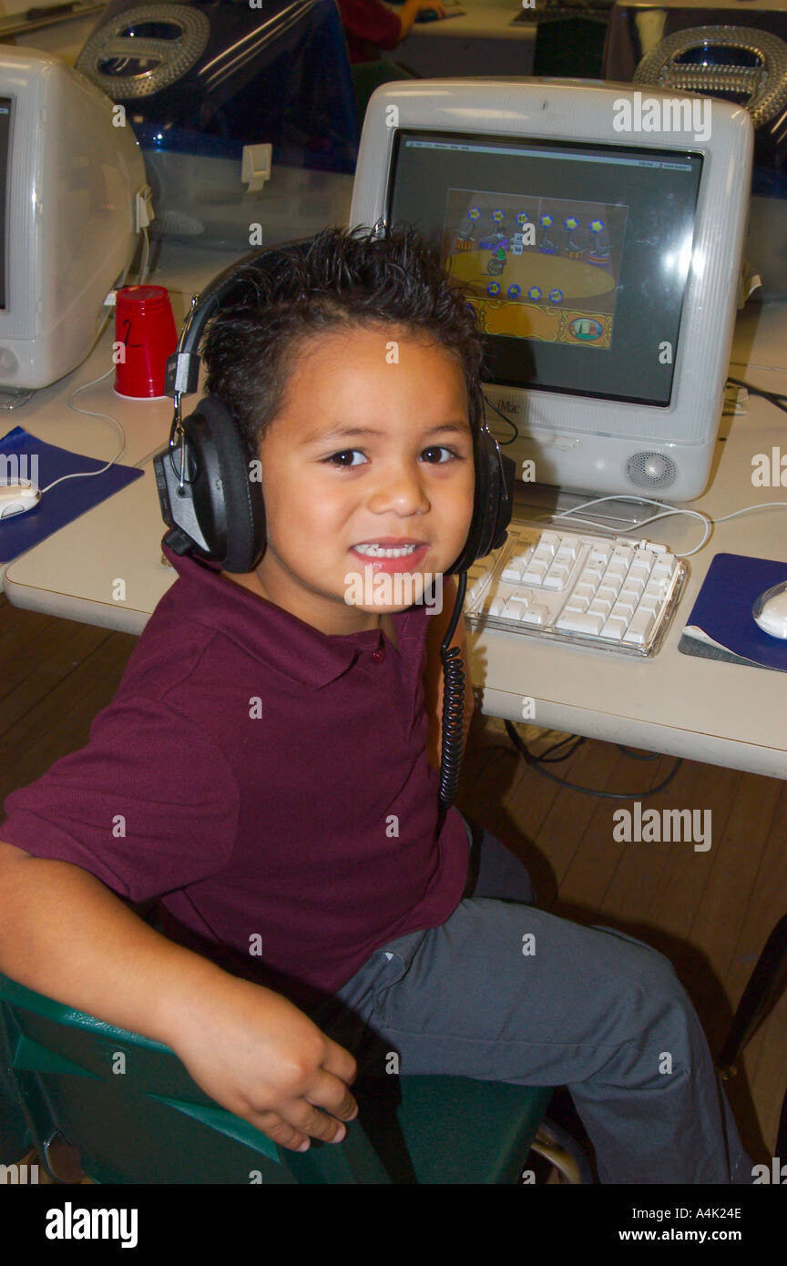 Hispanic boy at computer lab Stock Photo - Alamy