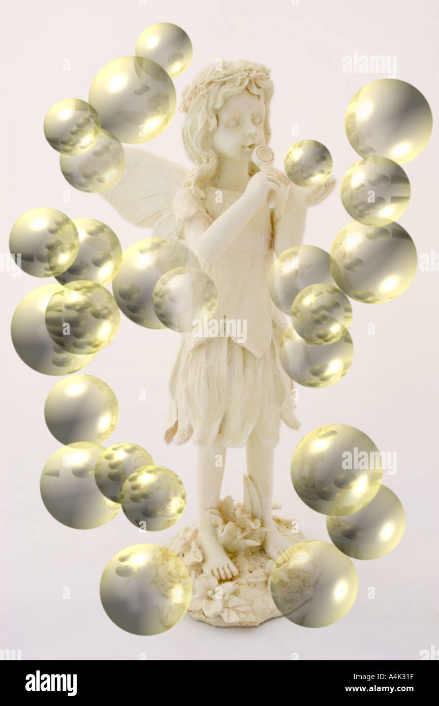 Statue of fairy blowing bubbles with additional bubbles Stock Photo - Alamy