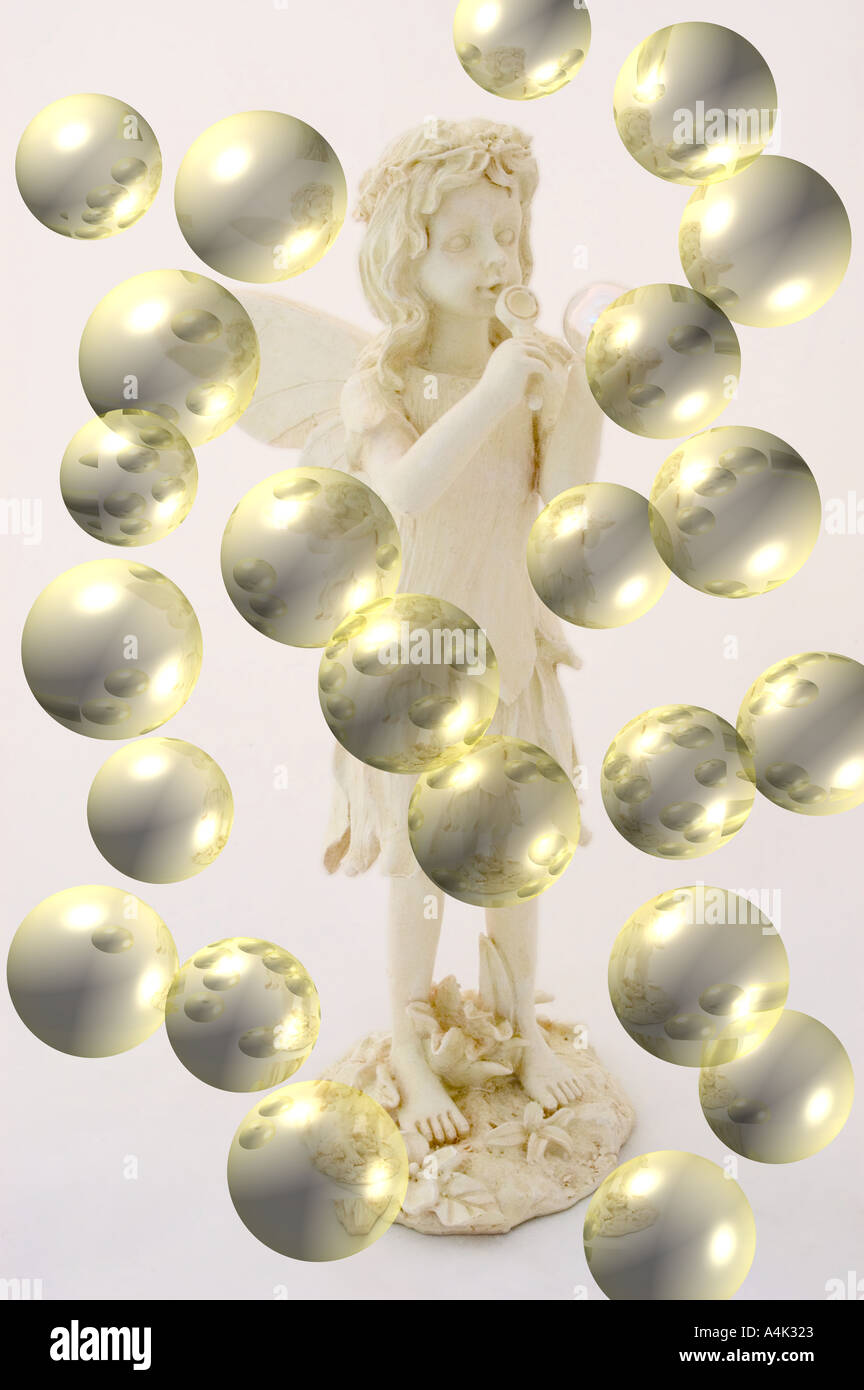 Statue of fairy blowing bubbles with additional bubbles Stock Photo - Alamy